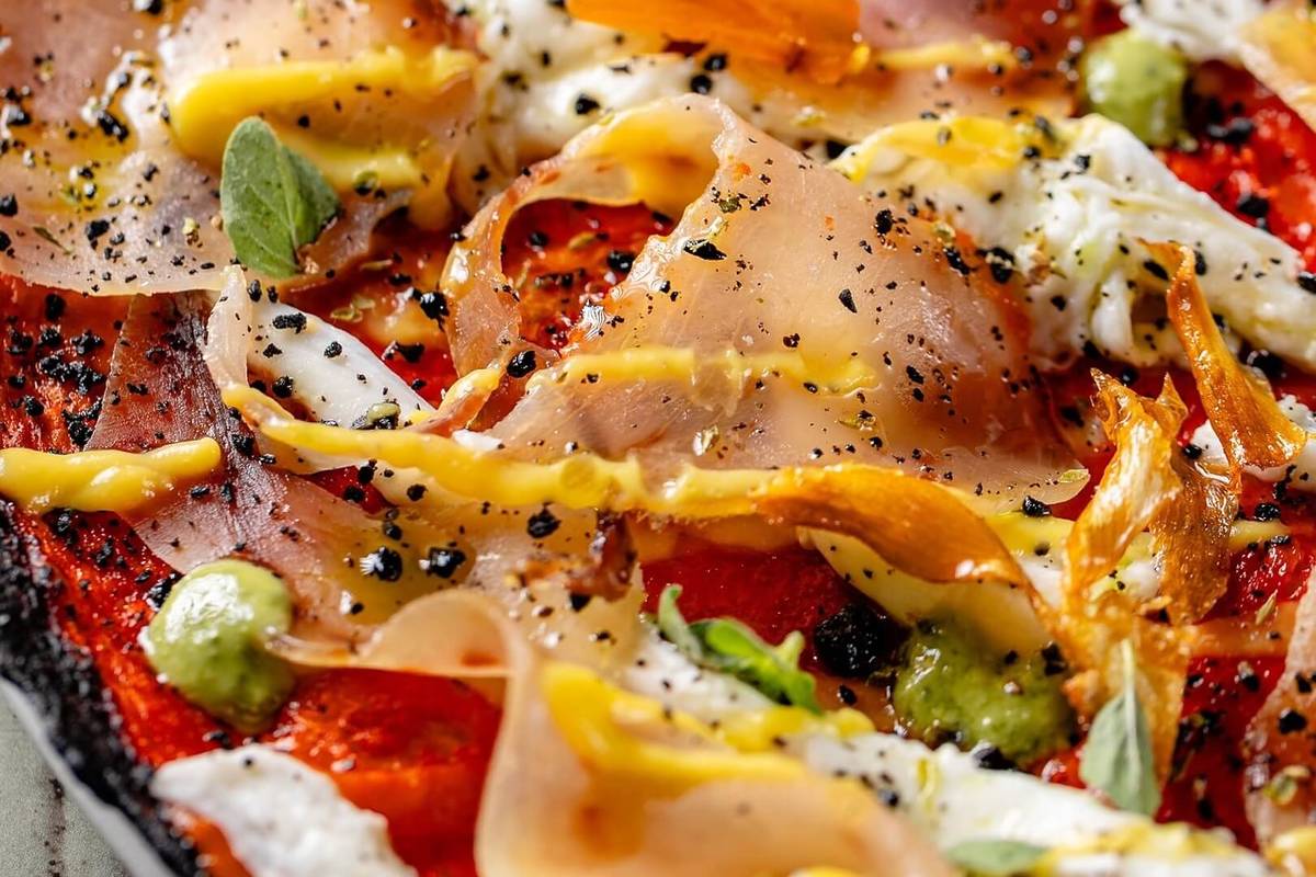 A Roman pizza legend opens in Milan to create a tasty new custom