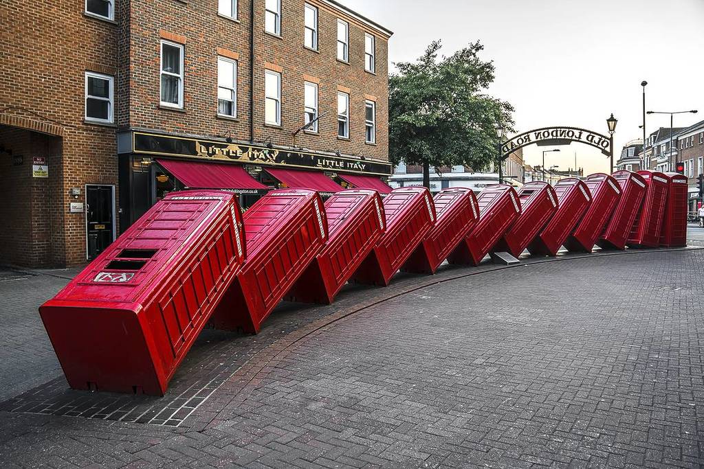 This Is The Story Behind London's Tumbling Telephone Boxes