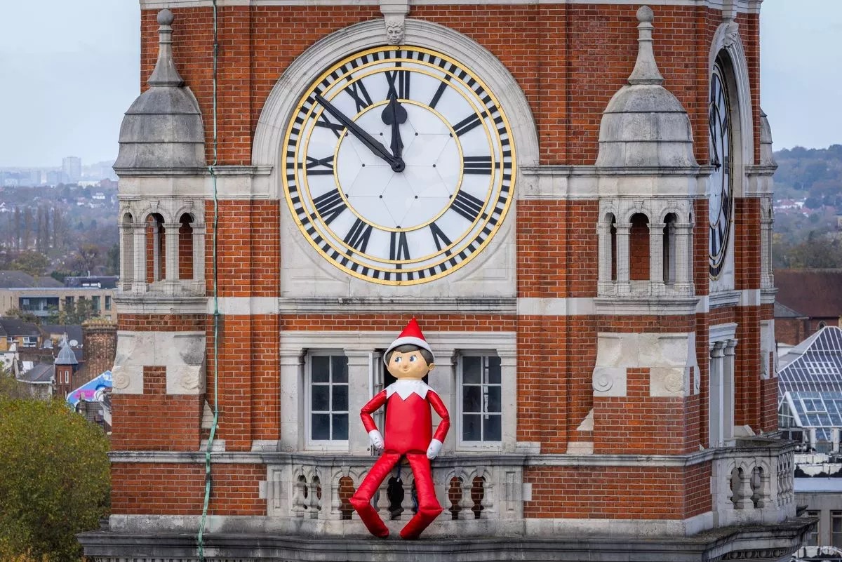 A Giant Elf On The Shelf Has Been Popping Up Around London