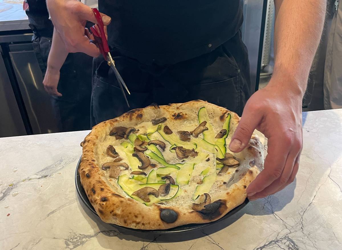 Cut Pizza With Scissors At New Manchester Pizzeria Forbici