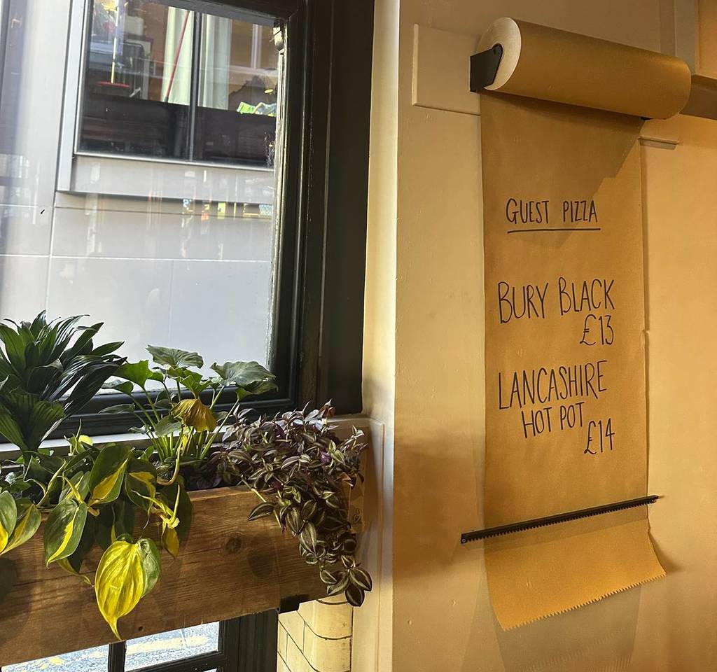 Cut Pizza With Scissors At New Manchester Pizzeria Forbici