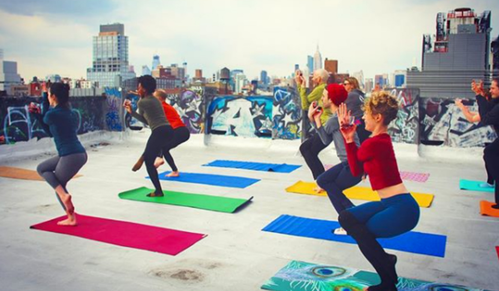 Wine-Down With This ‘Drunk Yoga’ Rooftop Class and Vino Happy Hour