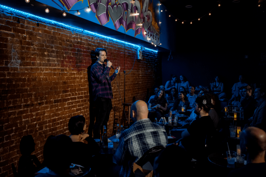 Step Into NYC’s Vibrant Comedy Speakeasy In The The East Village