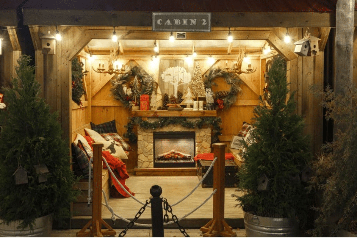 Cozy Up In An Adorable Cabin At This Waterfront Winterfest
